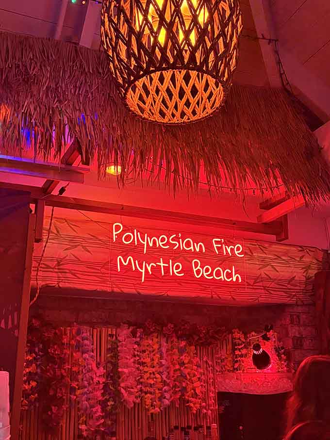 Fiery red lighting and woven palm decorations set the stage for an island escape without leaving the mainland.