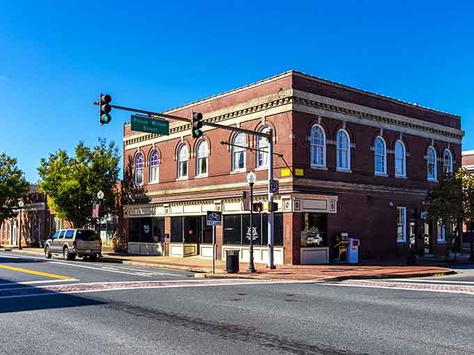 Corner buildings anchor intersections where arched windows and detailed brickwork showcase craftsmanship from another era entirely.