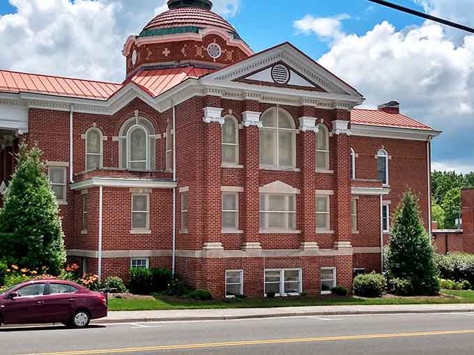 That ornate copper dome catches afternoon light like a beacon, marking the courthouse as the heart of this community.