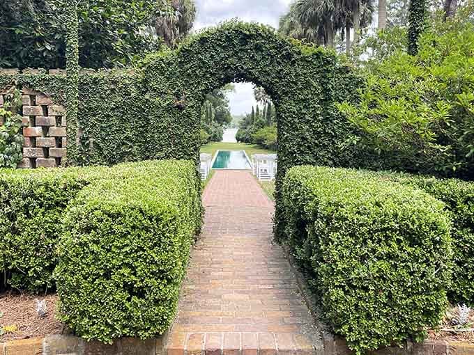 Perfectly manicured hedges frame a secret garden entrance that would make even Alice curious about what lies beyond.