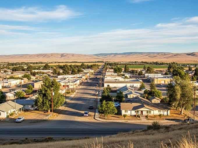 Golden light kisses the rooftops as day ends, painting this modest town in colors that money simply cannot buy.