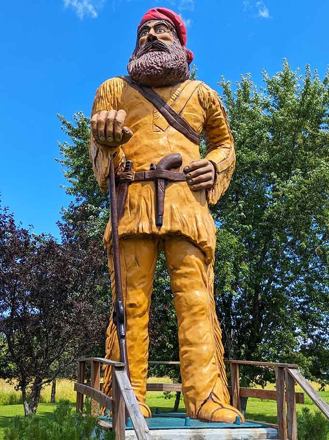 Standing tall against the trees, this voyageur statue captures the rugged spirit of Minnesota's frontier past.