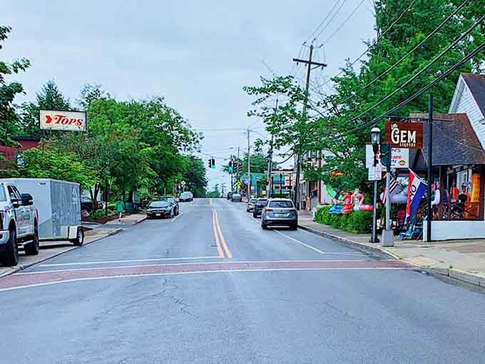 Summer greenery surrounds this peaceful main drag where the pace of life moves slower than molasses uphill.