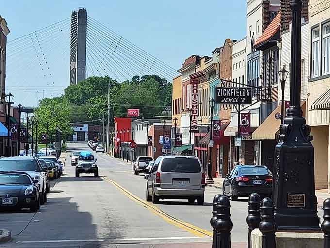The modern bridge towers over historic streets where river commerce once ruled and community spirit still thrives strong today.