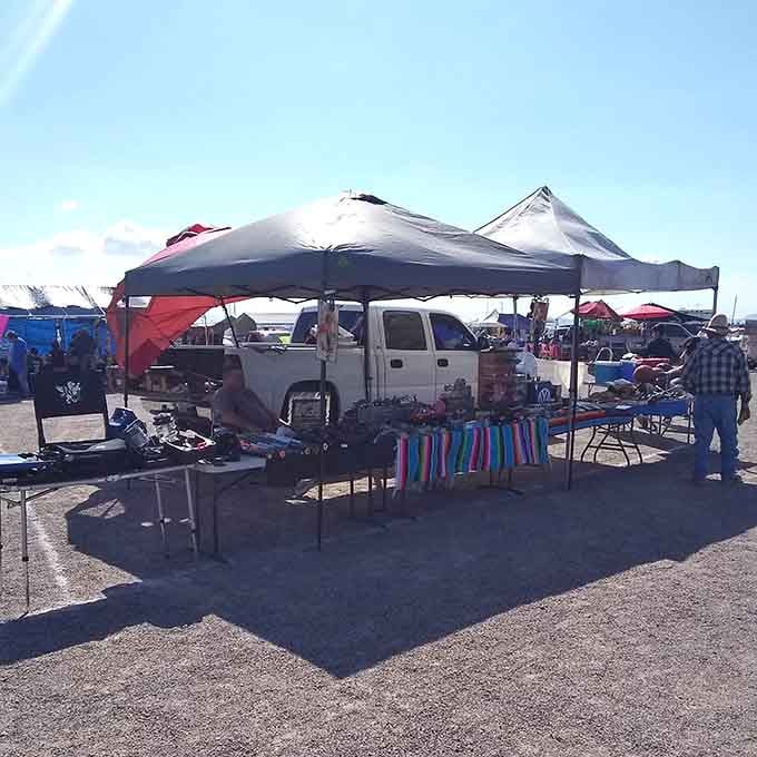 Simple tents and folding tables under endless sky capture the authentic spirit of community commerce at its finest.