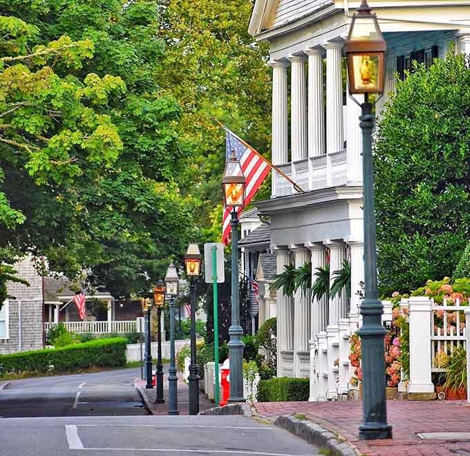 Gas lamps and pristine columns frame a street scene that makes you want to slow down and savor simplicity.