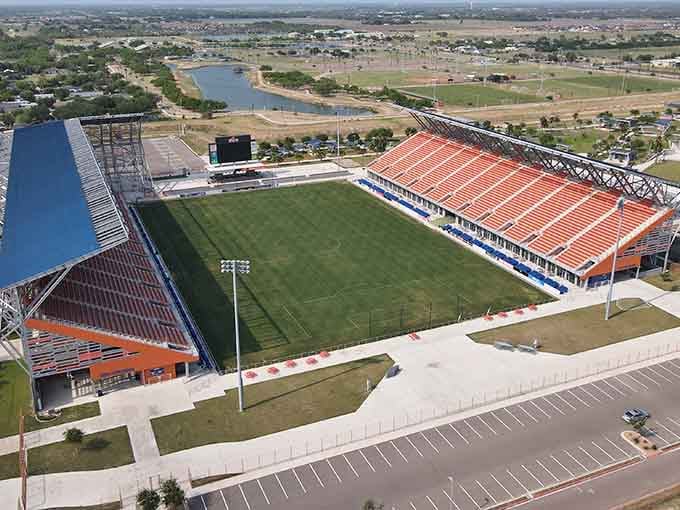 The stadium sits ready for action, where community spirit runs higher than the score on any scoreboard ever could.