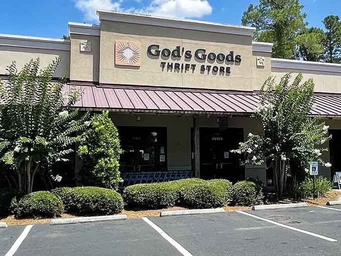 Manicured shrubs frame the entrance like this thrift store is ready for its close-up in a magazine.