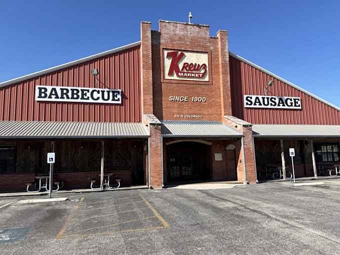 The red and brick exterior of Kreuz Market stands like a monument to meat. BBQ cathedral, Texas-style.