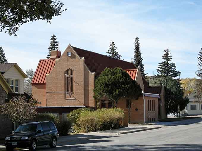 Nestled among evergreens, this charming brick church offers a peaceful counterpoint to Rawlins' rugged frontier history.