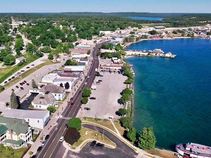 Lake Michigan stretches to the horizon while the town nestles along the shore, perfectly balanced between water and land.