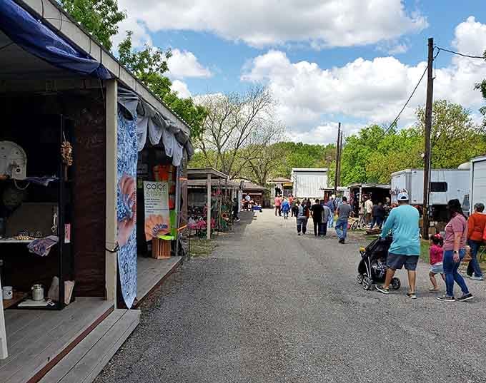 Tree-lined pathways between vendor stalls create a relaxed outdoor shopping experience where discovery happens at your own leisurely pace.