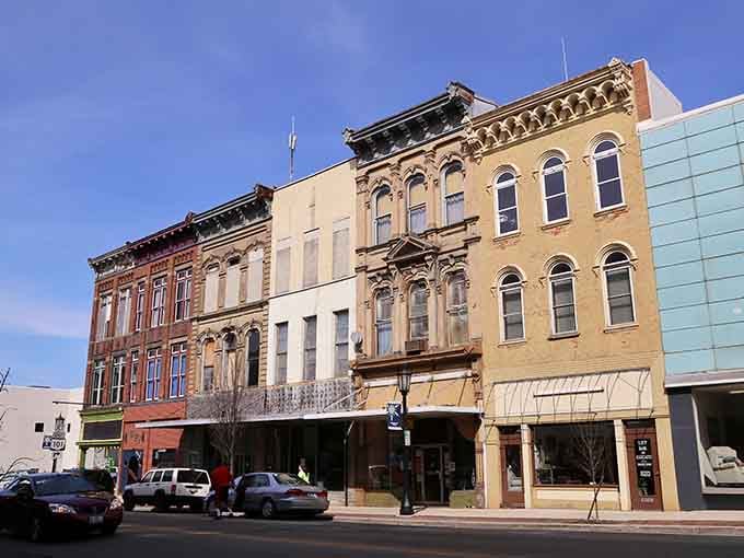 Colorful storefronts stand shoulder to shoulder like old friends, inviting you to explore without emptying your pockets first.