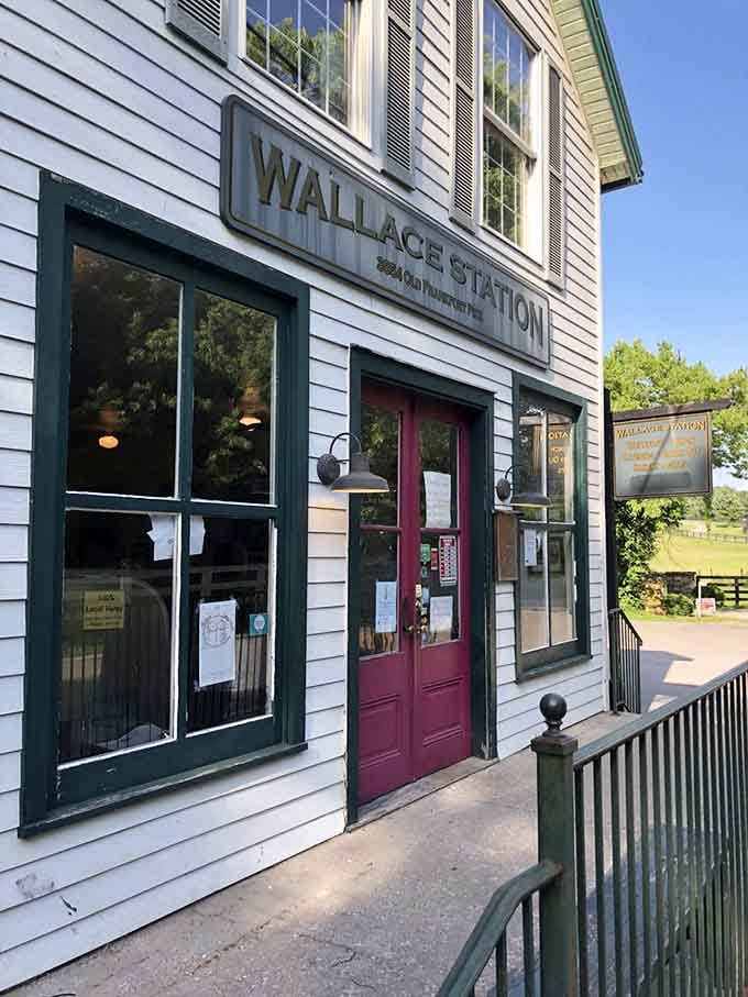 The burgundy door and green trim give this converted station house the kind of character you just can't fake.
