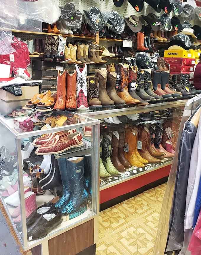 Cowboy boots in every color imaginable line the shelves, from classic tan to electric blue snake skin.