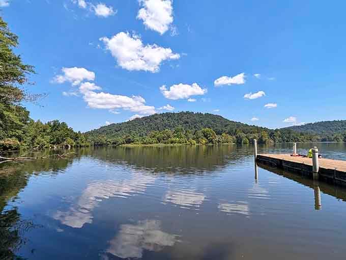 That mirror-smooth lake reflecting the mountains? That's your invitation to slow down and actually breathe for once.