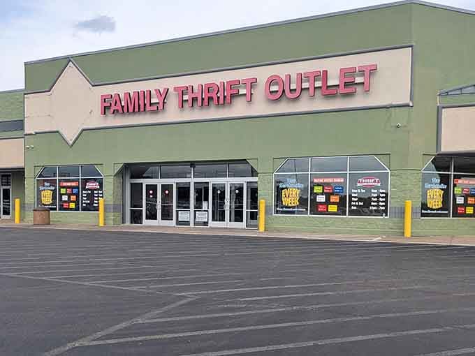 That bold pink signage against sage green walls proves even thrift stores can have serious curb appeal.