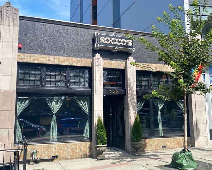 That unassuming storefront is your gateway to pizza paradise, hiding in plain sight on a Seattle street.