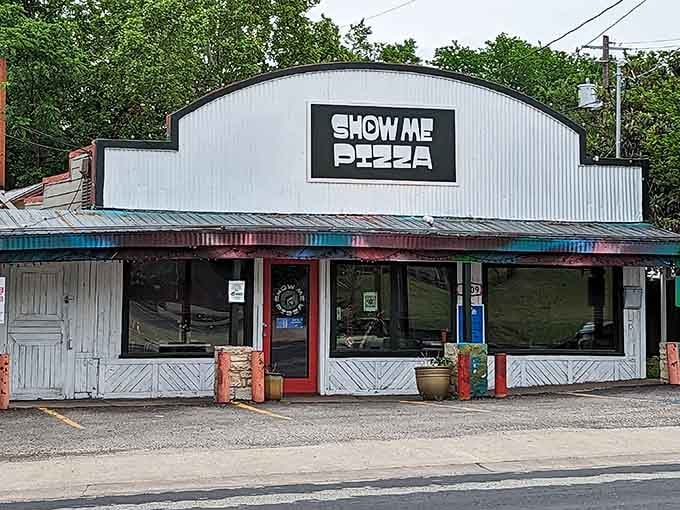 That corrugated metal exterior hides some serious pizza magic, proving you can't judge a restaurant by its humble cover.