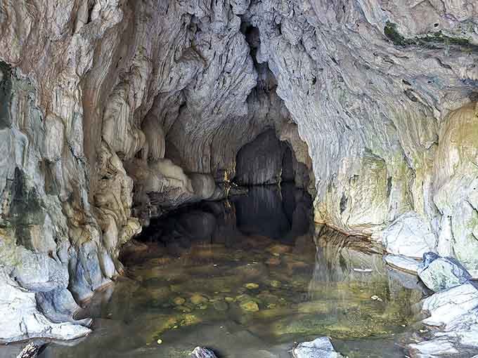 The entrance to Coyote Creek Cave looks like nature's own private swimming club, minus the membership fees.