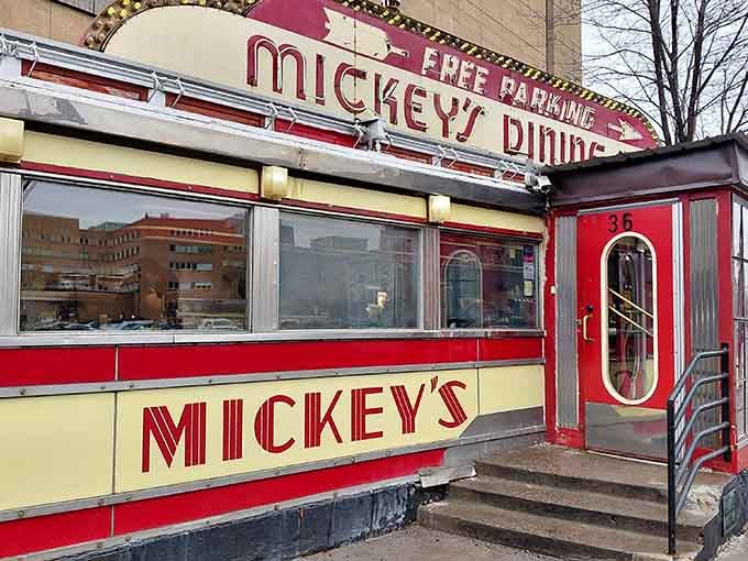 That gleaming red and yellow Art Deco beauty isn't a movie set; it's your next breakfast destination calling.