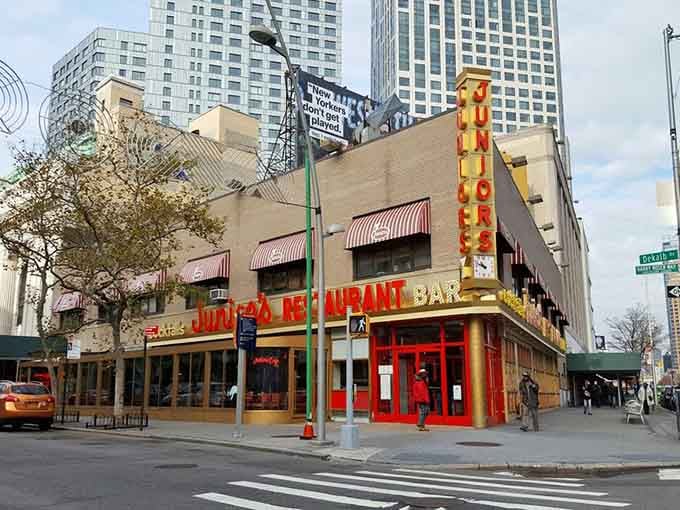 That iconic vertical sign towers over Brooklyn like a delicious beacon calling hungry souls to cheesecake heaven.