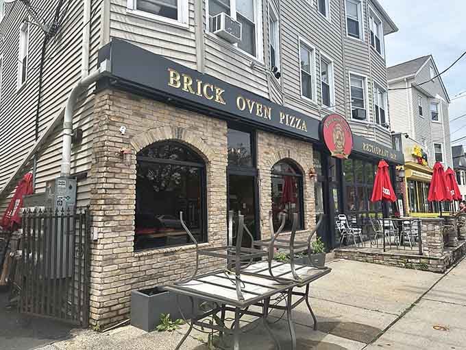 Fire Engine Pizza Co's brick oven exterior promises authentic flavors while the patio whispers "summer evenings done right."
