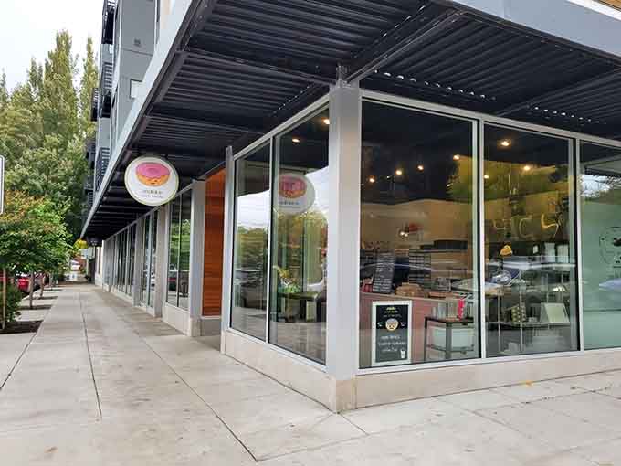 That storefront with the cheerful donut logo is basically waving you inside like an old friend with fresh pastries.