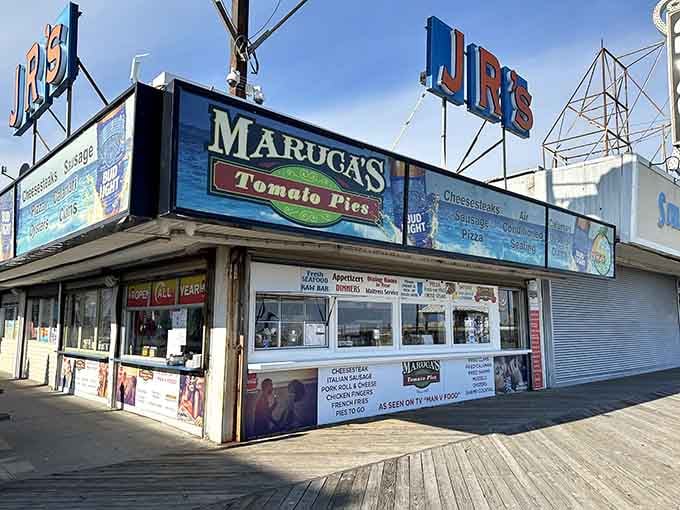 That classic boardwalk sign promises tomato pie perfection, and spoiler alert: it absolutely delivers on every delicious word.
