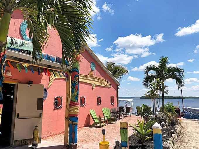 That pink exterior isn't shy about announcing paradise, and honestly, neither would you be with waterfront views like these.