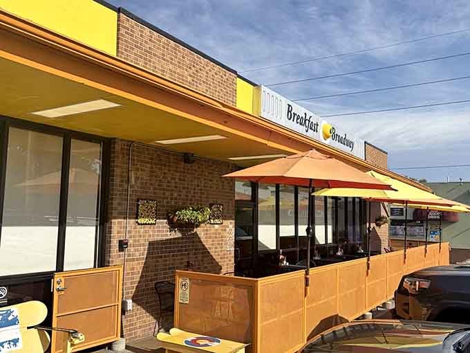 Those cheerful yellow awnings aren't just decoration, they're basically waving you in for breakfast like an enthusiastic friend.