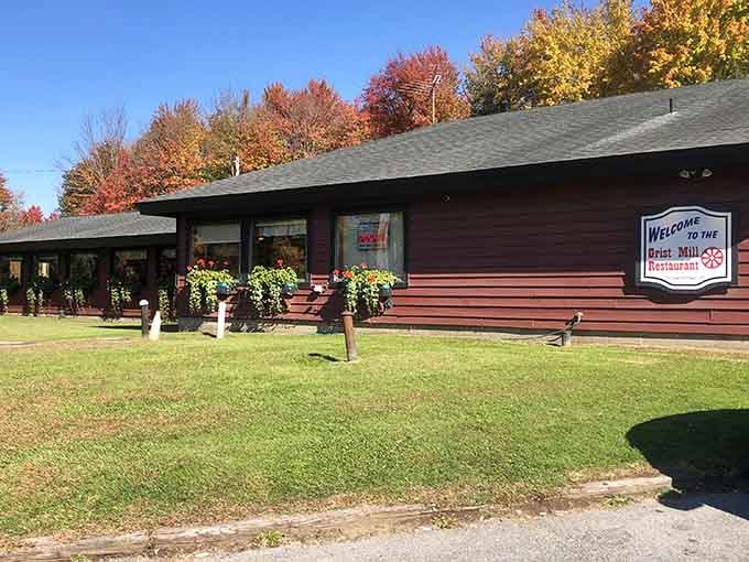 That rustic wooden exterior isn't trying to fool anyone, it's a gas station that happens to serve legendary meals.