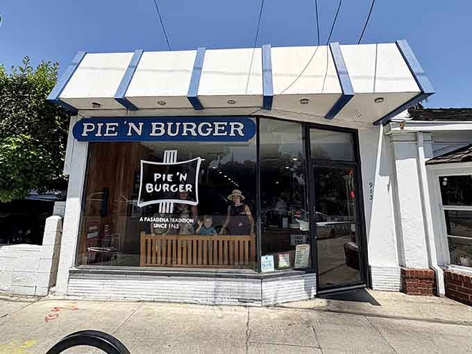 That striped awning has been beckoning burger lovers like a lighthouse guides ships home for decades.