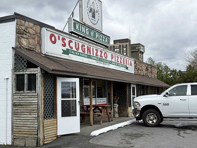 That "King of Pizza" sign isn't just bragging, it's a promise they've been keeping for generations of hungry customers.