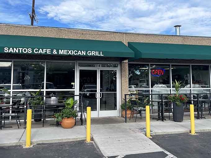 That green awning and those yellow bollards are your roadmap to burrito bliss in Denver.