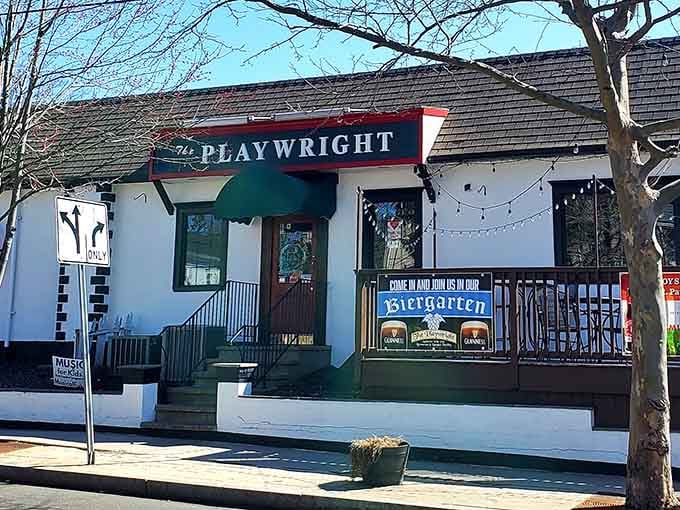 That charming green awning and twinkling lights promise something special hiding behind those doors on Whitney Avenue.
