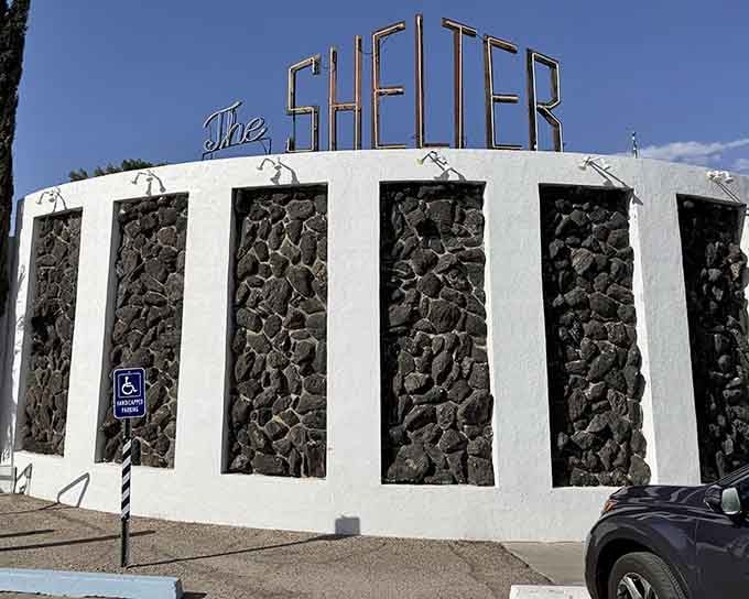 That retro-futuristic facade isn't just for show, it's your portal to the coolest bunker this side of the Cold War.