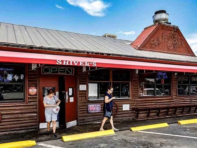 That distinctive roofline and glowing OPEN sign are calling you toward barbecue paradise in Homestead's most beloved smokehouse.