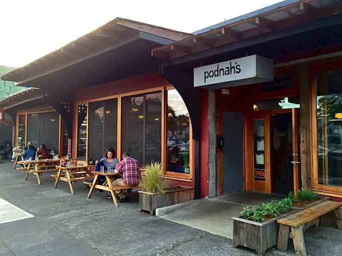 Golden hour at Podnah's, where diners gather outside and the smoke drifts skyward like barbecue incense.