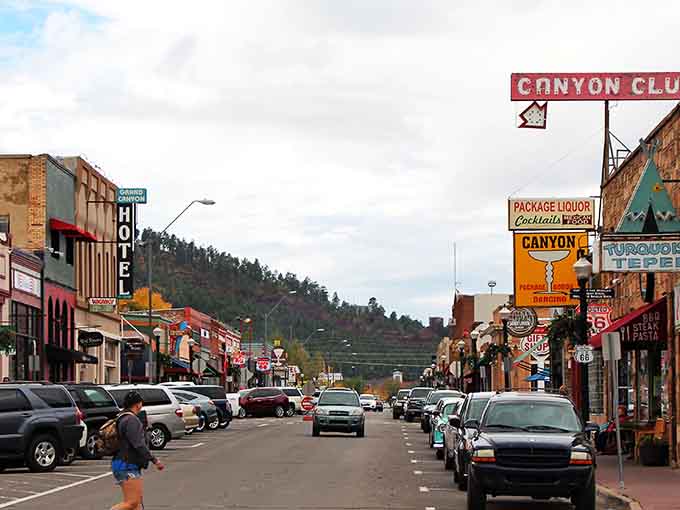 Historic Route 66 runs straight through downtown Williams, where vintage neon signs glow against pine-covered mountains like a postcard from America's golden age.