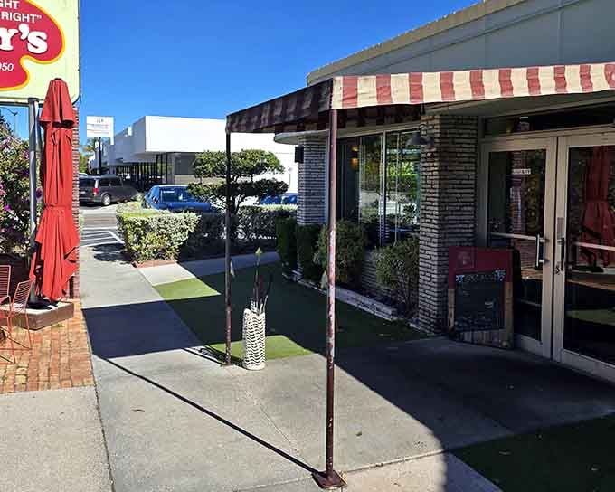 That striped awning isn't just decoration, it's a beacon calling you home to breakfast done right.