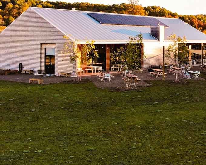 Modern barn meets agricultural paradise where your dinner grows steps from your table in pure Michigan style.