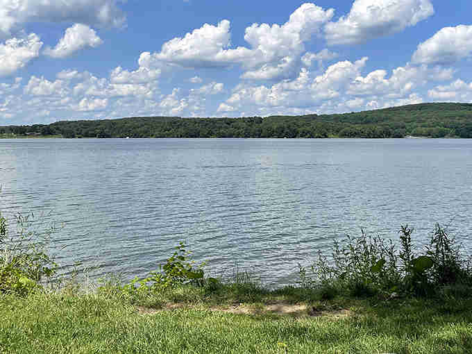 Lake Arthur stretches out like nature's own mirror, reflecting clouds that seem close enough to touch.