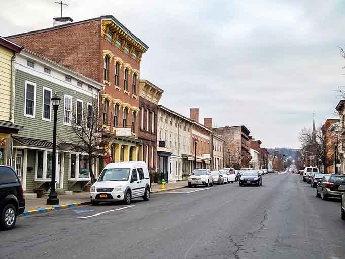 Warren Street stretches before you like a perfectly preserved time capsule with actual parking spots.