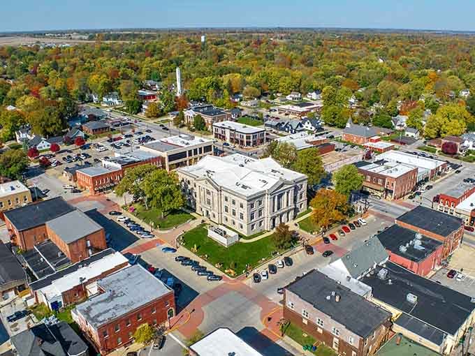 The courthouse stands proud among historic buildings, a testament to architectural ambition in America's heartland communities of yesteryear.