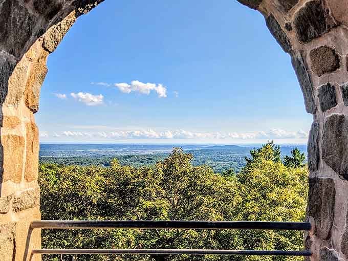 Through ancient archways, Long Island Sound stretches to the horizon, reminding you why people climb mountains in the first place.