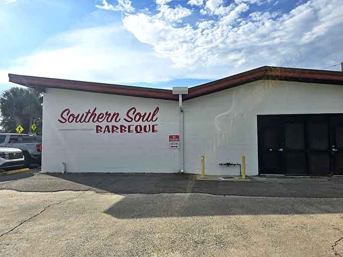 The simple white building hides serious barbecue credentials; never judge a smokehouse by its unassuming cover, friends.
