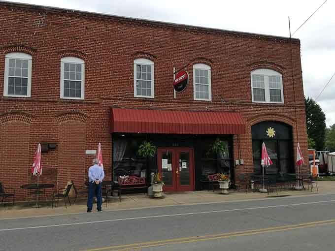 That red awning beckons like a lighthouse guiding hungry souls to salvation, one perfectly fried piece at a time.