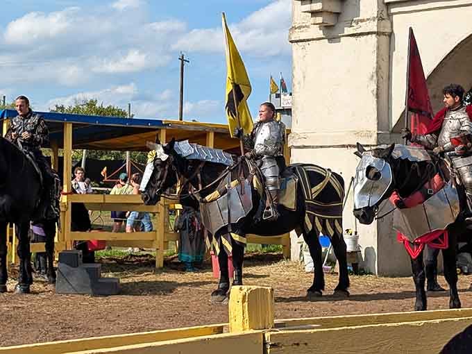 Armored knights on horseback face off in the jousting arena, lances ready for thunderous medieval combat.