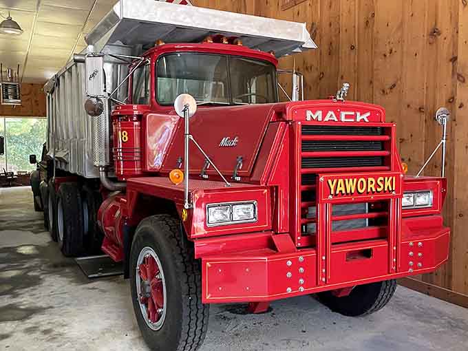 That gleaming red Mack truck isn't just transportation, it's a work of art on wheels.